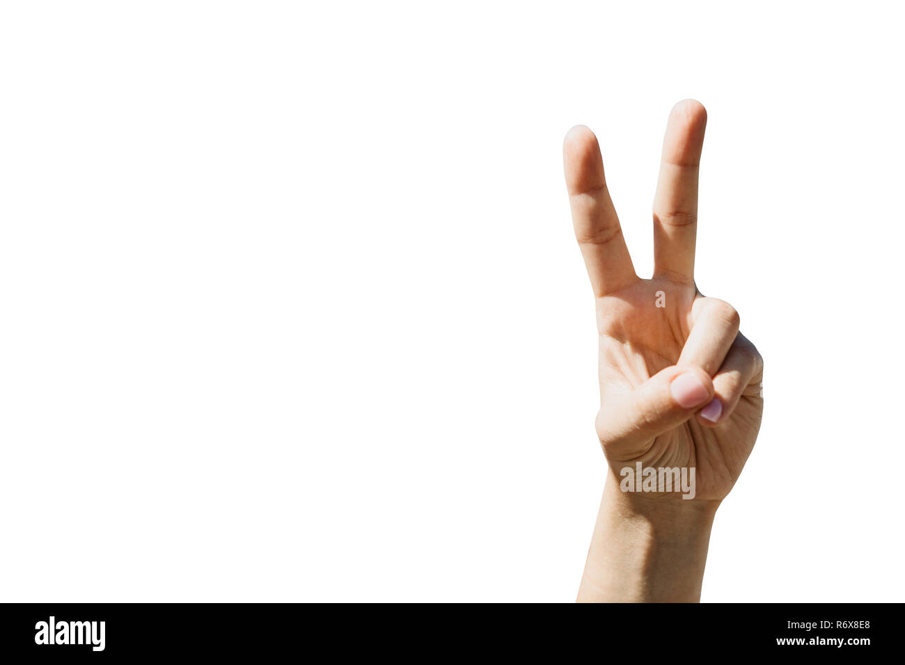 Girl shows peace sign on a white background Stock Photo - Alamy