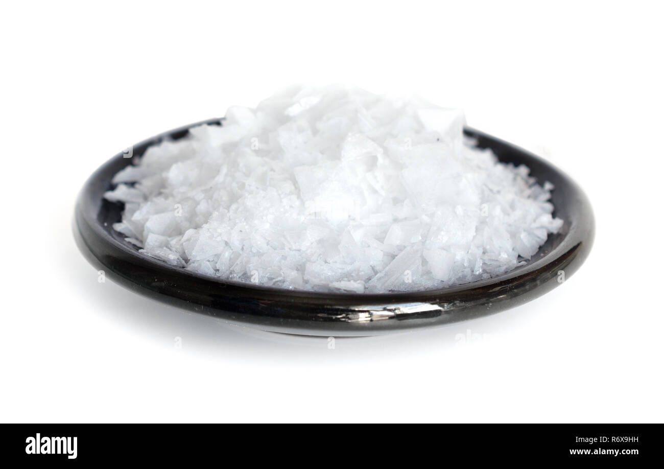 Pyramide Crystal Flakes of Cyprus Salt. Isolated on white background ...