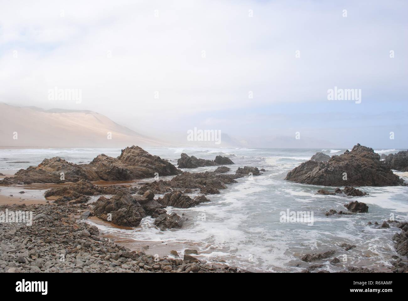 rocks on the beach of Peru Stock Photo - Alamy
