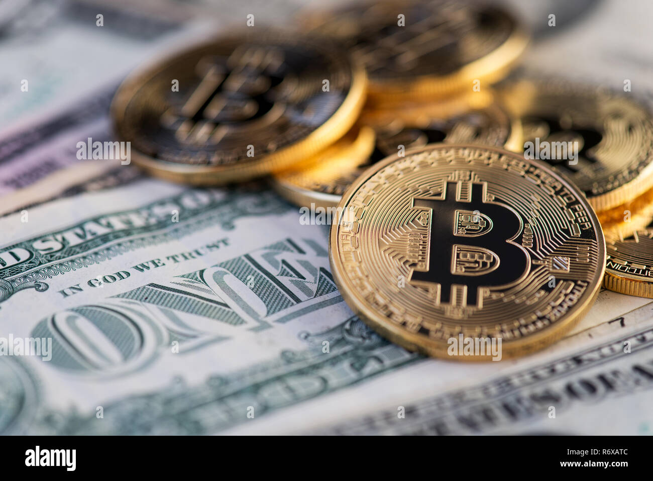 Bitcoin and banknotes of one dollar Stock Photo - Alamy