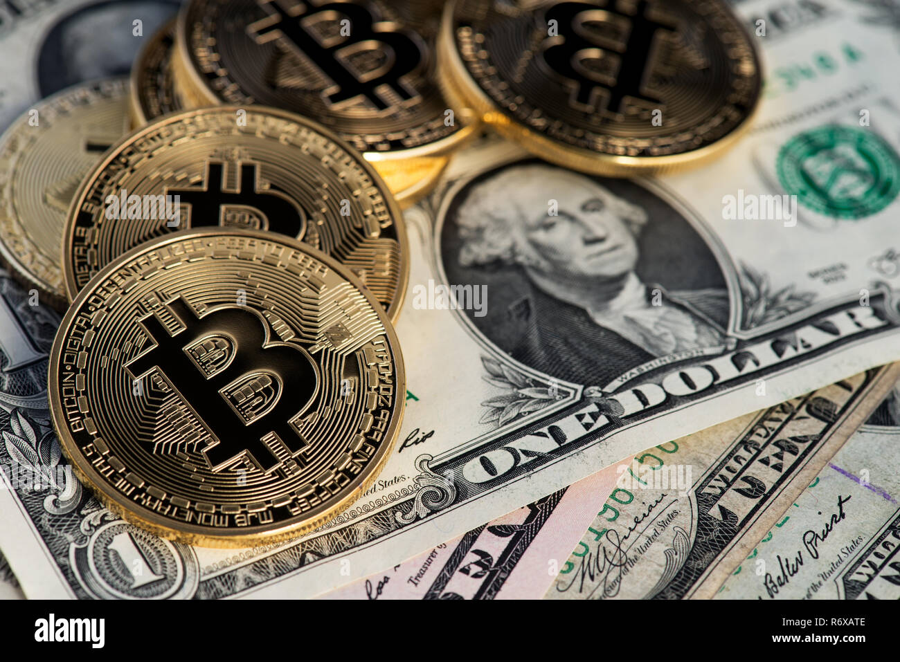 Bitcoin and banknotes of one dollar Stock Photo - Alamy