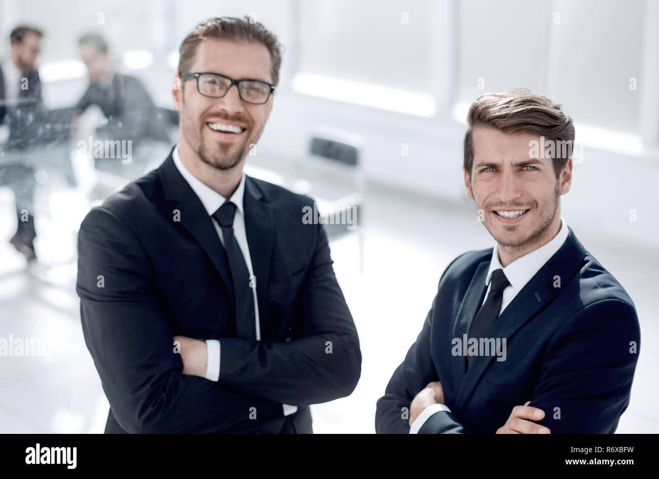 business partners standing in the office Stock Photo - Alamy