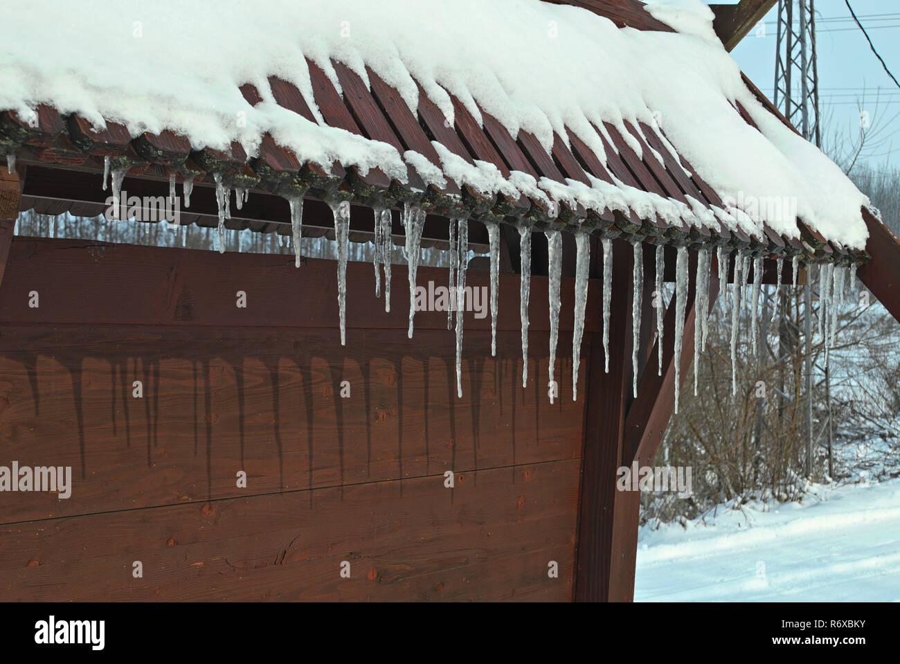 Frozen ice crystals hanging from roof top Stock Photo - Alamy