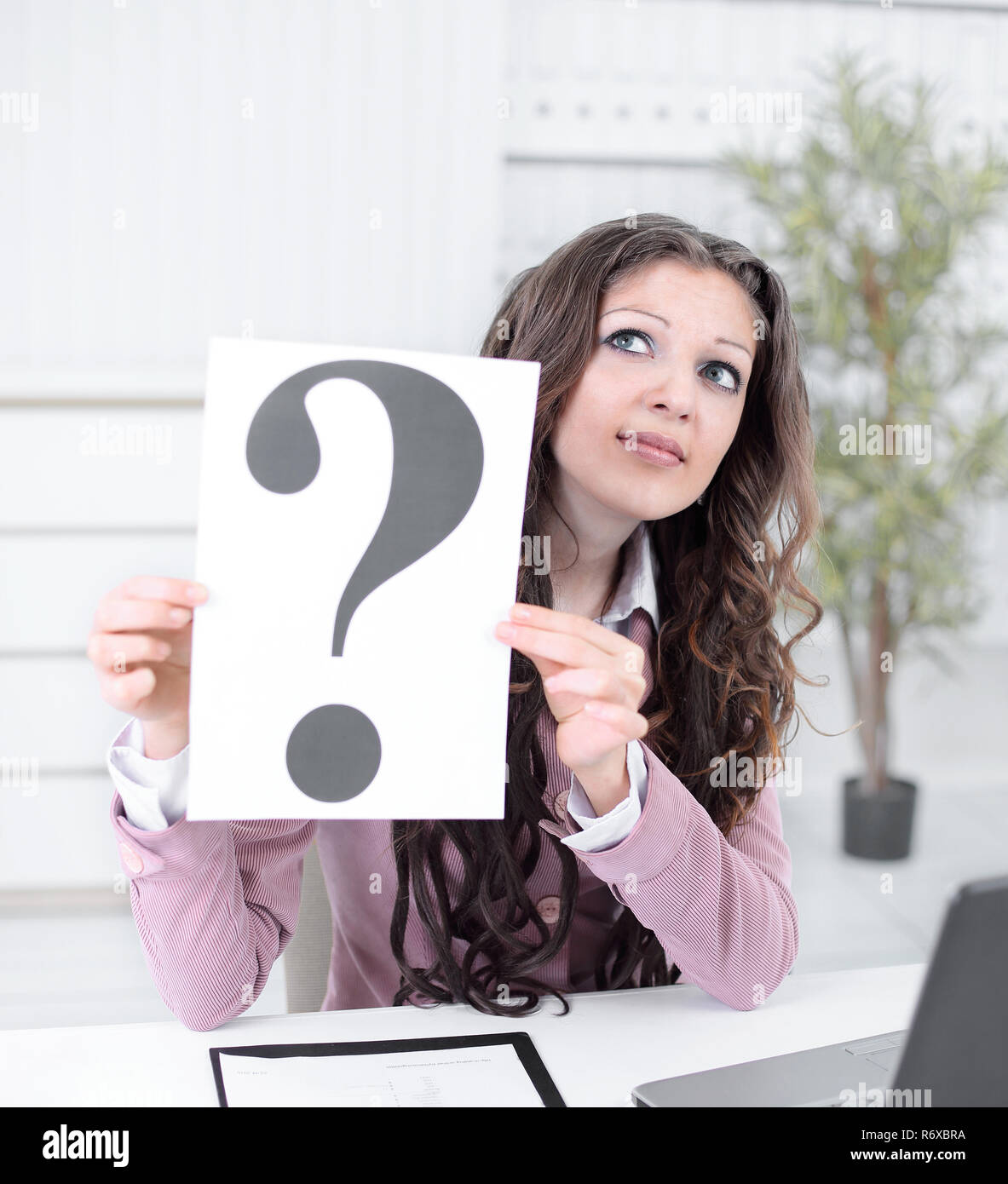 thoughtful business woman showing a question mark Stock Photo - Alamy