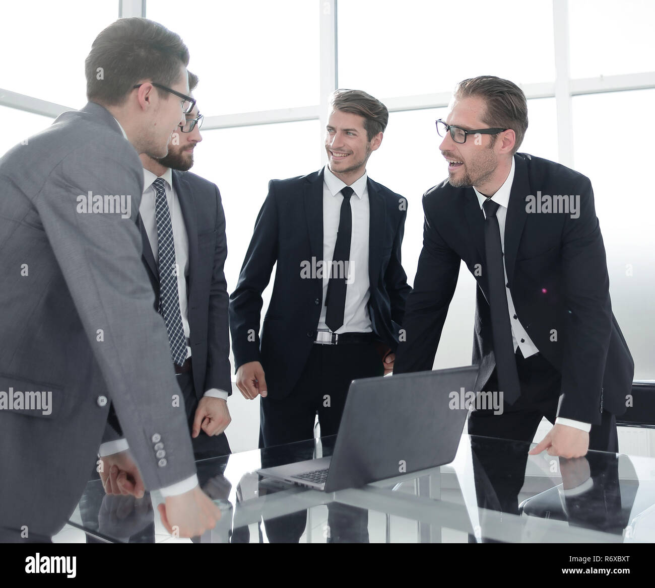 boss and employees in the workplace in the office Stock Photo - Alamy