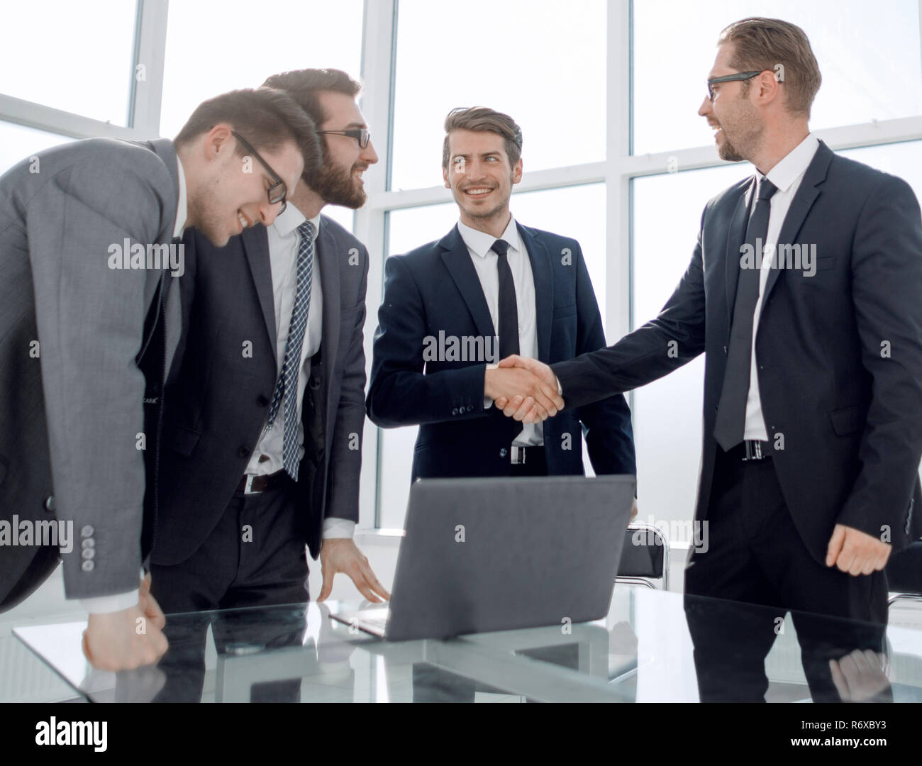 employees shaking hands with each other when meeting at the offi Stock ...