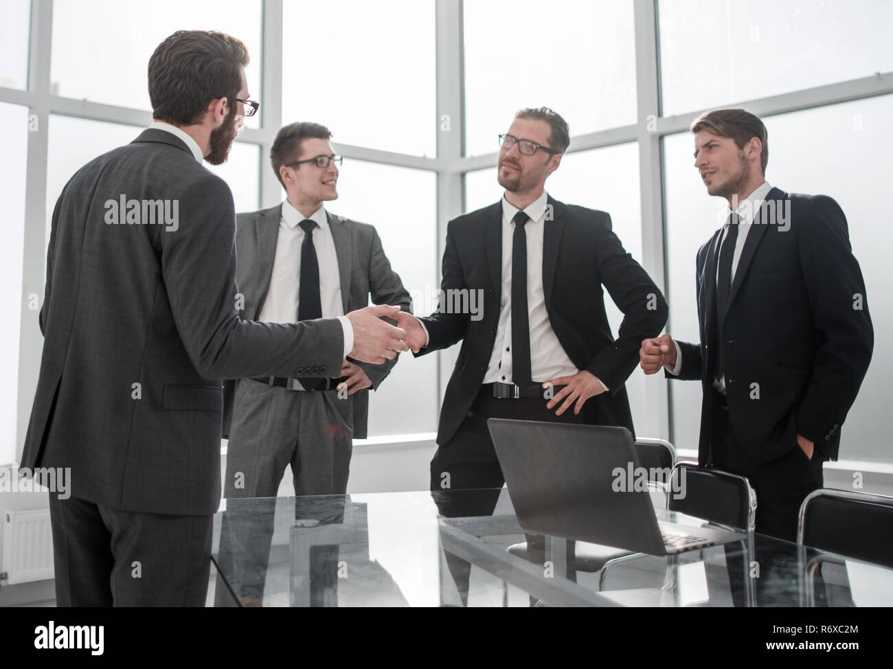 business partners standing in the conference room Stock Photo - Alamy