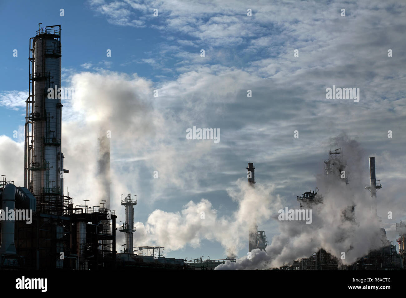 Interesting image of an oil refinery in the middle of white smoke ...