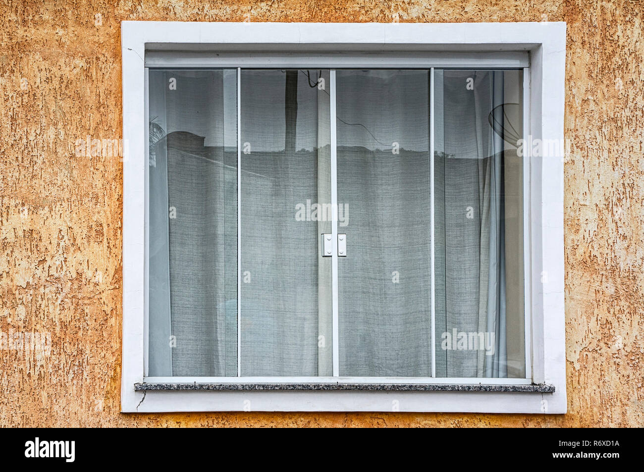 modern glass window textured orange wall architecture Stock Photo - Alamy