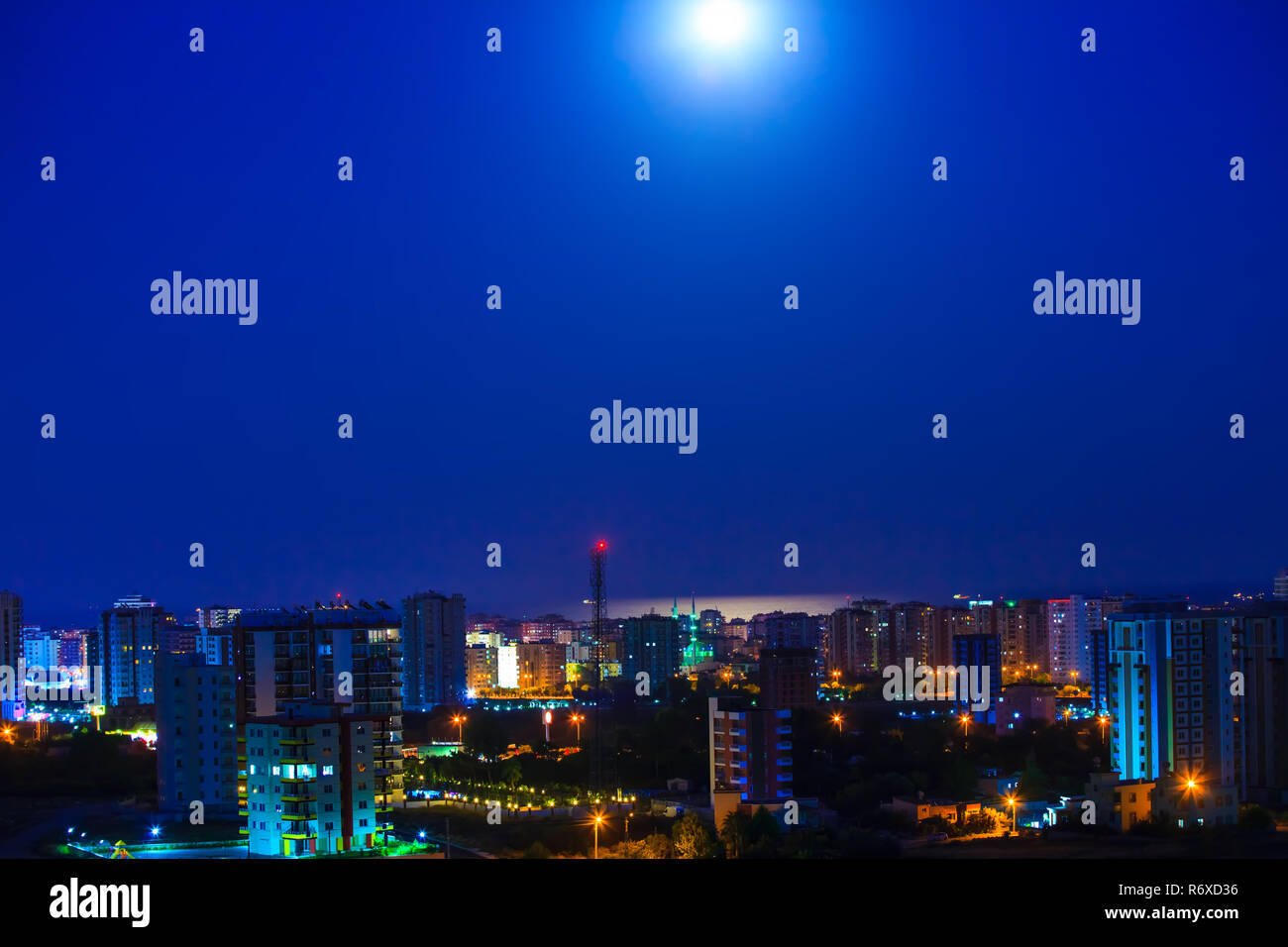 City Night View With Moon Stock Photo - Alamy
