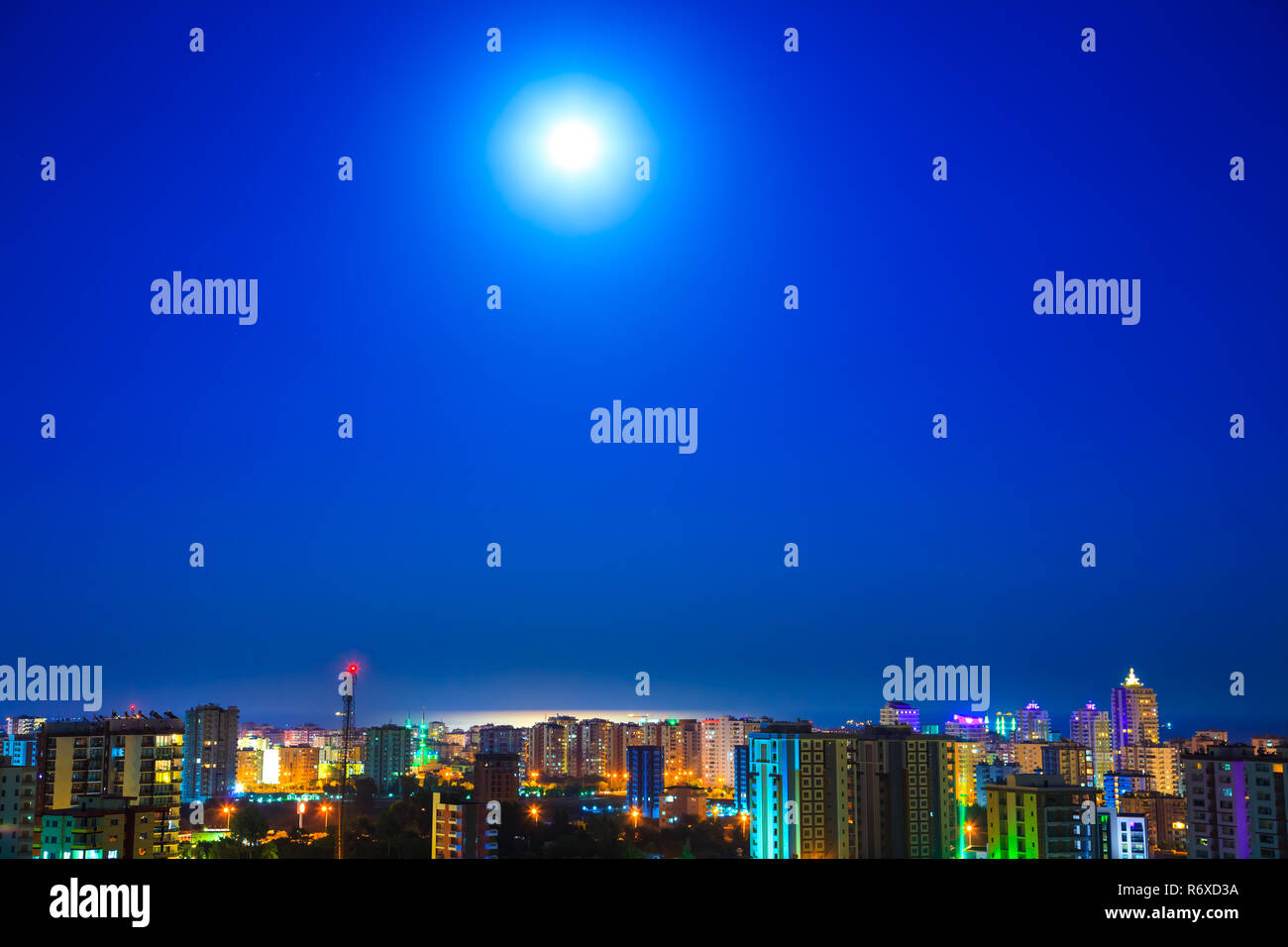 City Night View With Moon Stock Photo - Alamy