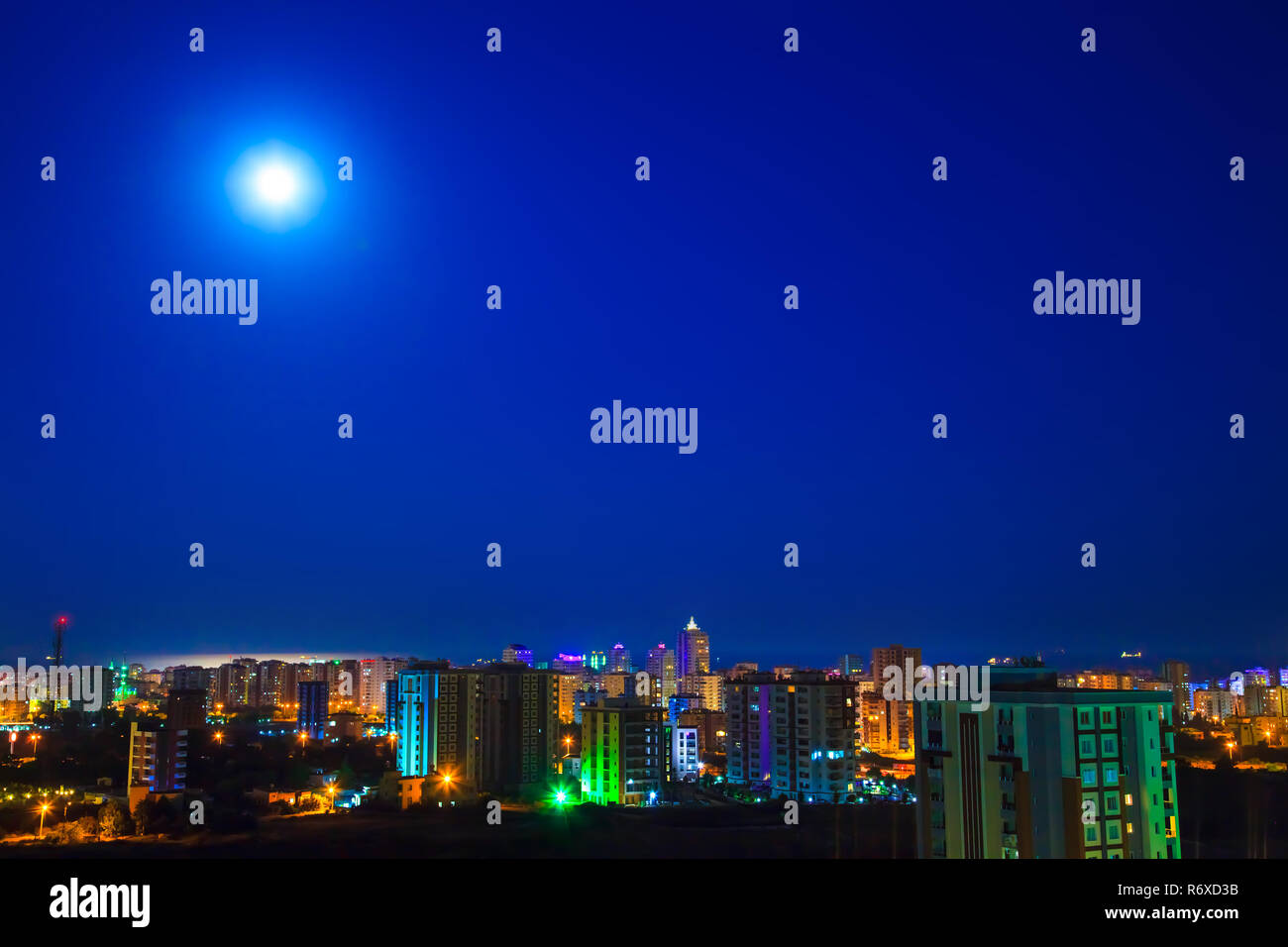 City Night View With Moon Stock Photo - Alamy