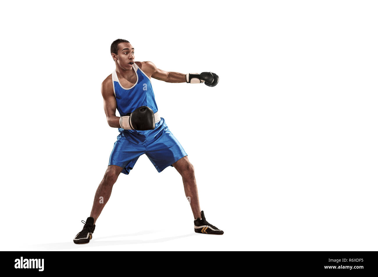 Sporty man during boxing exercise making hit. Photo of boxer on white ...