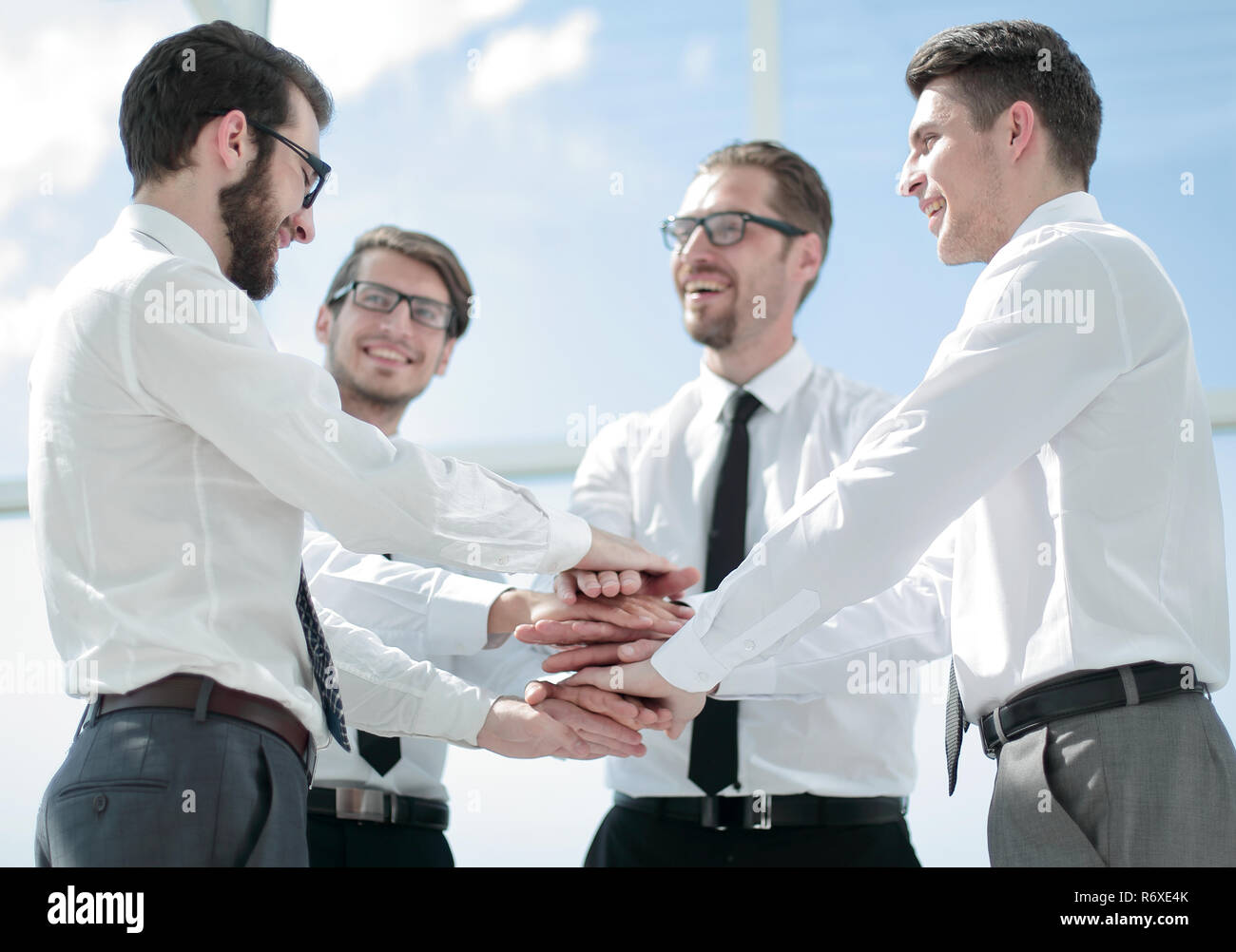 close up.a group of business people folded their hands together Stock ...