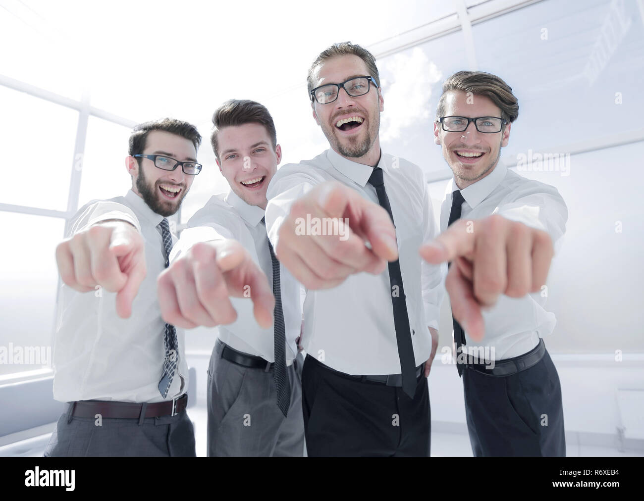 happy employees pointing at you Stock Photo - Alamy
