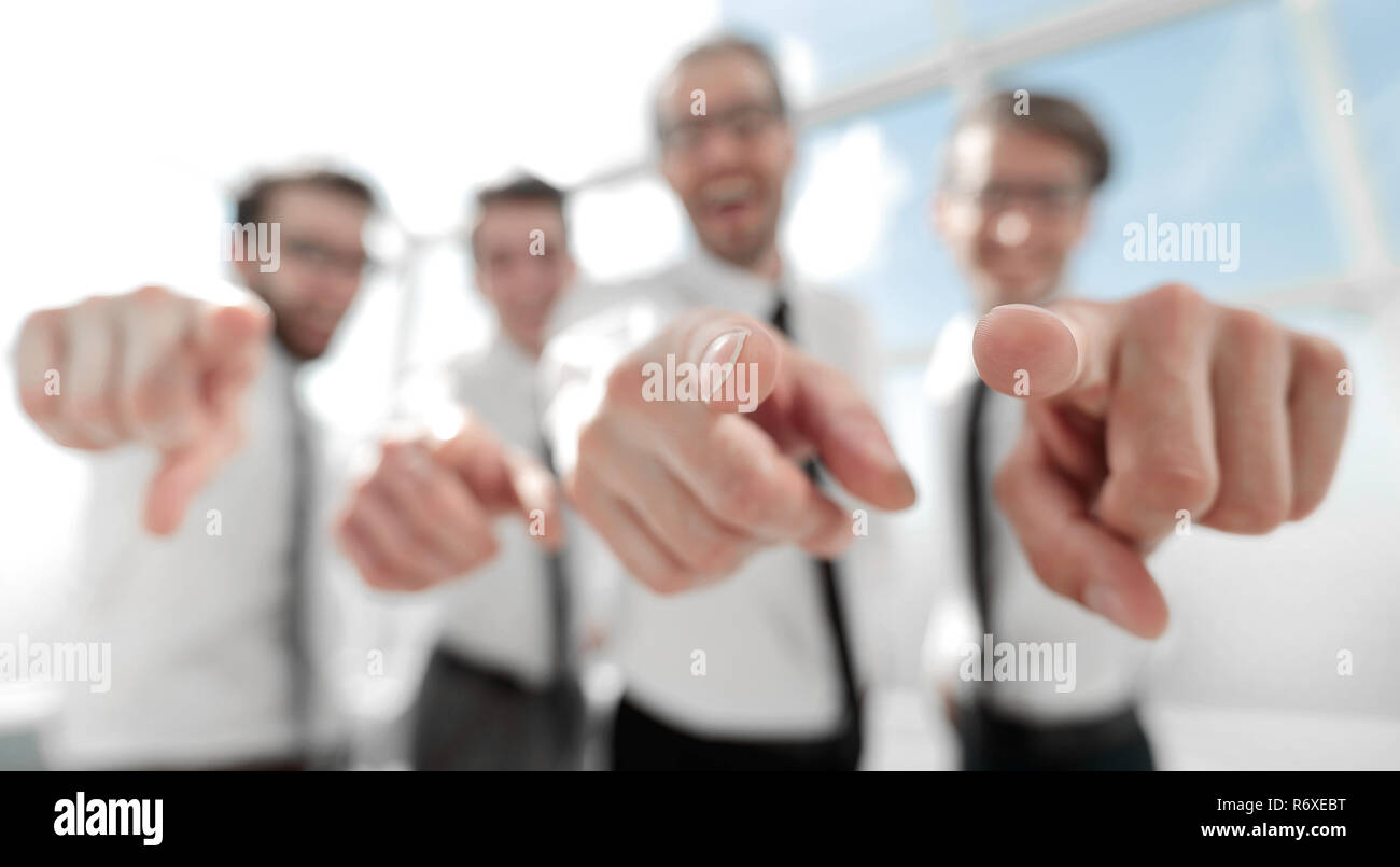 business background.happy employees pointing at you Stock Photo - Alamy