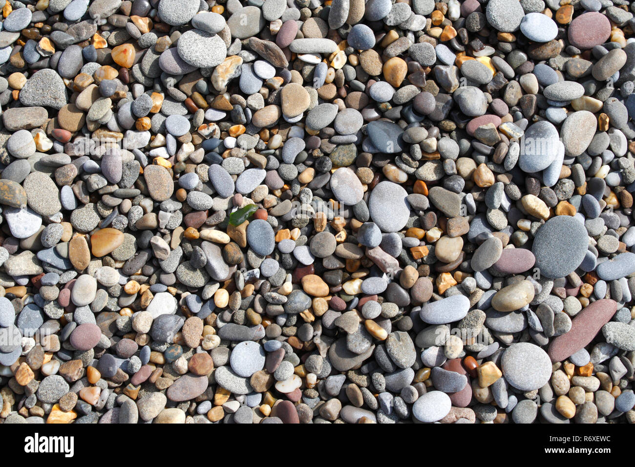 Pebbles on a beach, seaside coastline Stock Photo - Alamy