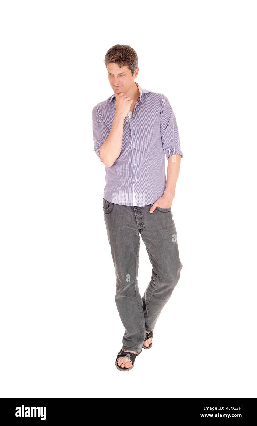 Caucasian man standing and thinking Stock Photo - Alamy