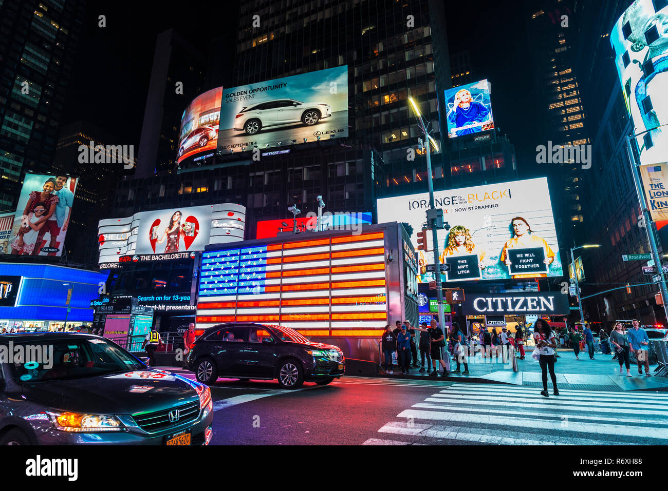 New York City, USA - July 30, 2018: Times Square at night with people ...