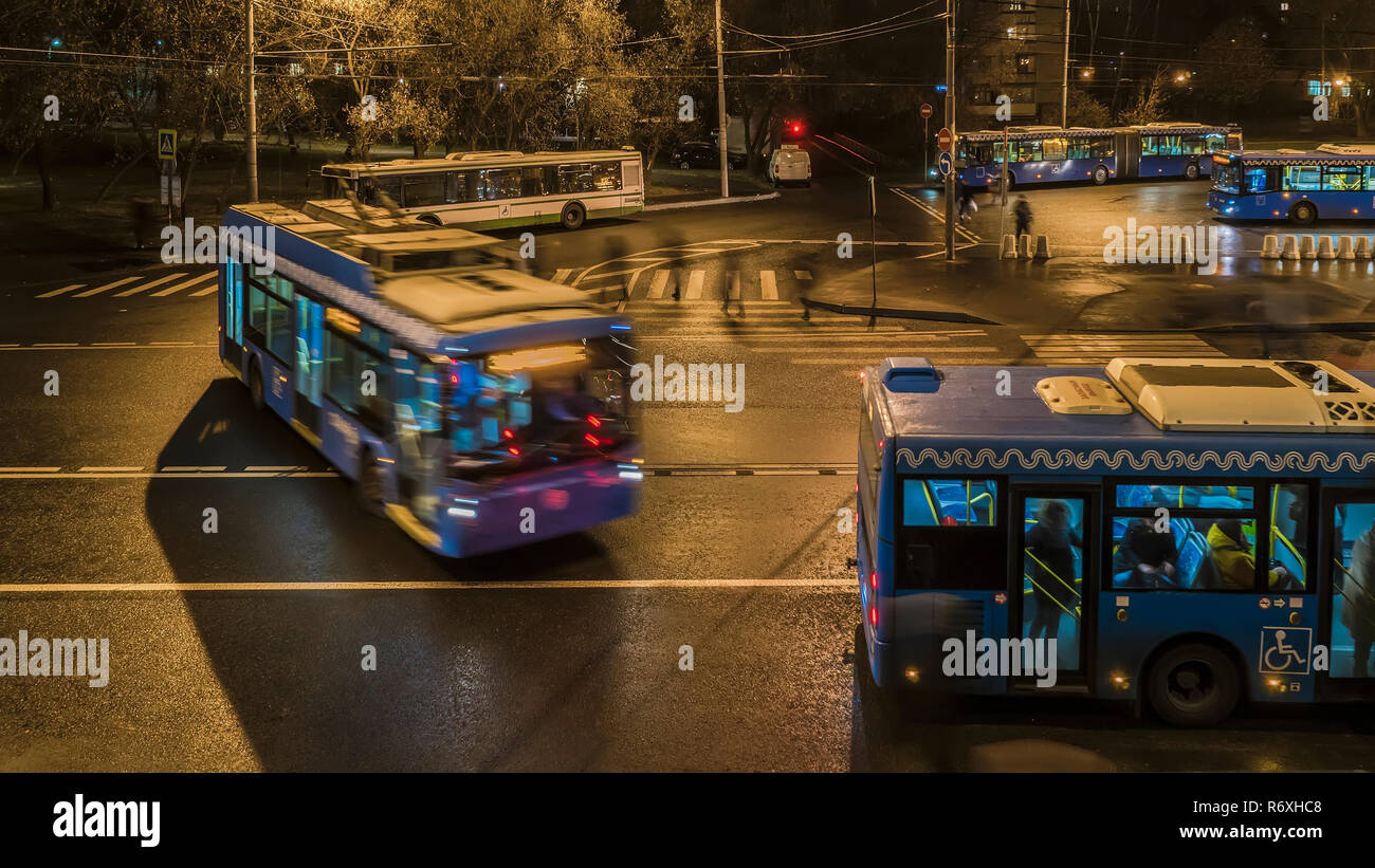 passengers waiting and boarding buses at the bus terminal Stock Photo ...
