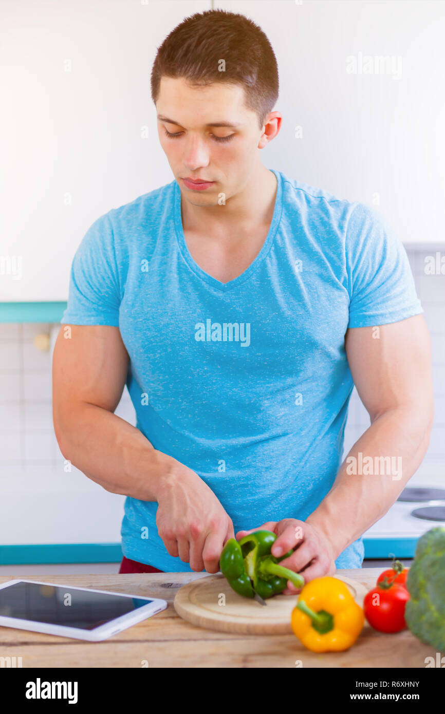 young man cook food vegetables lunch internet tablet portrait healthy ...