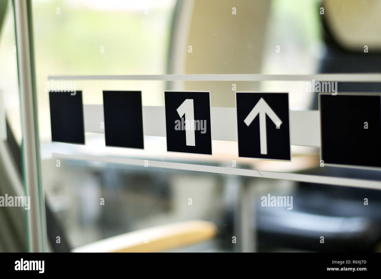 glass door in a train compartment with a 1 as a symbol for first class ...