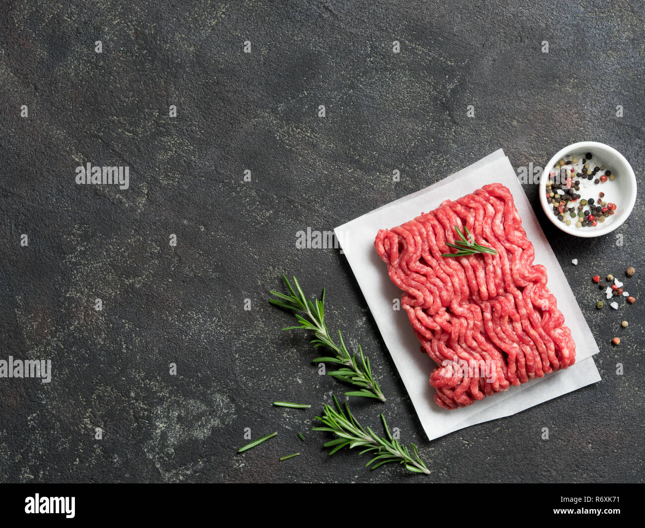 raw minced beef on light gray cement background Stock Photo - Alamy