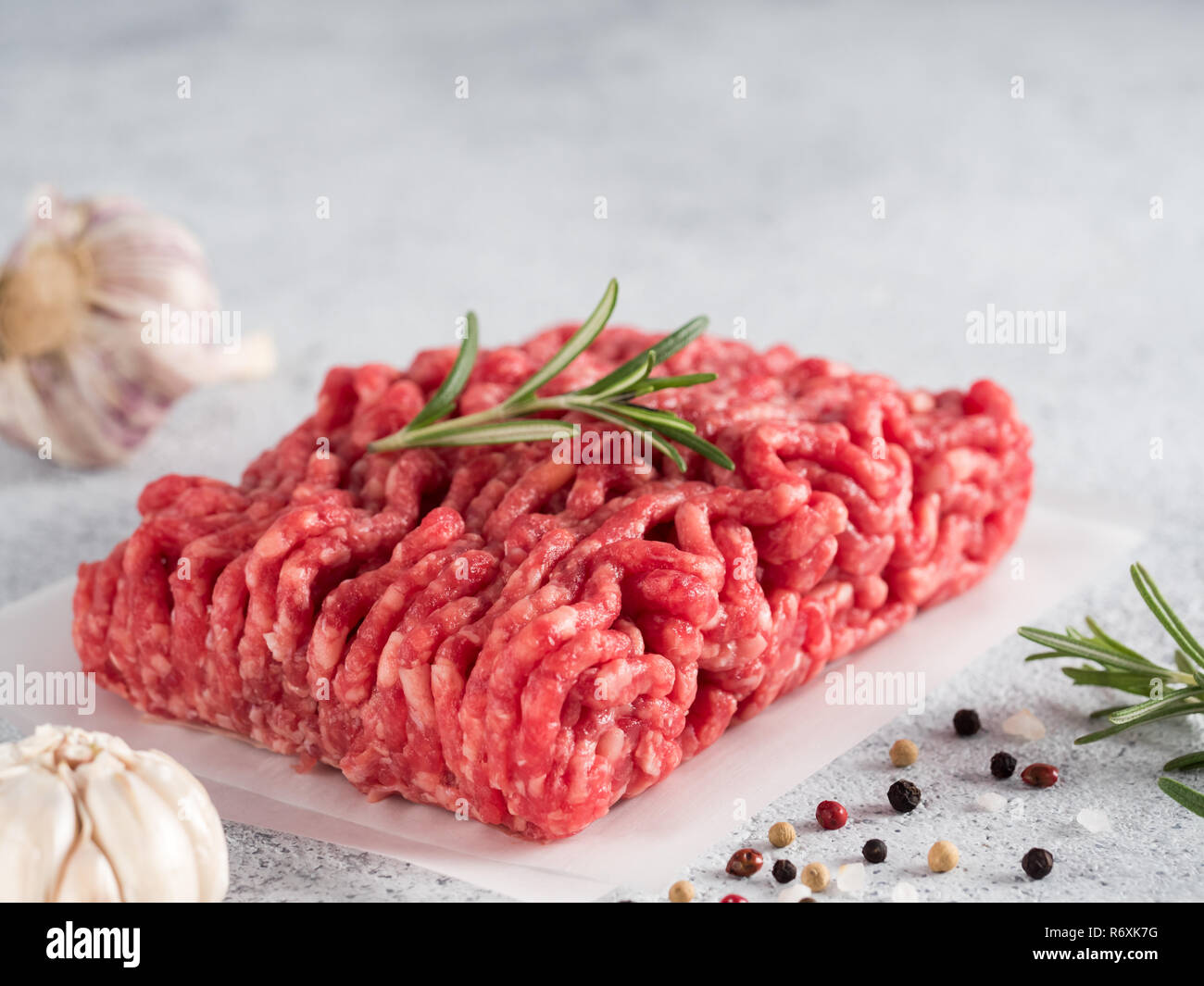 raw minced beef on light gray cement background Stock Photo - Alamy