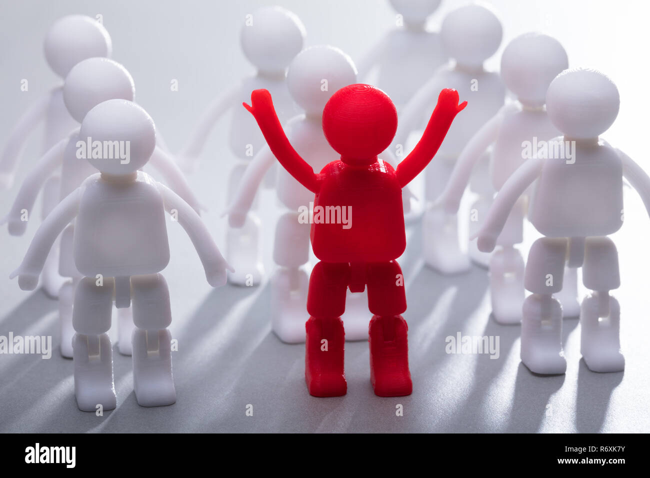 Red Human Figure Standing With Team In A Row Stock Photo - Alamy