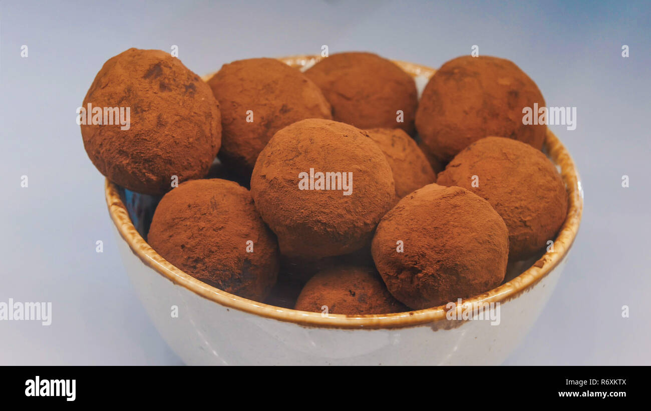 Chocolate truffles sprinkled dark chocolate in the bowl Stock Photo - Alamy