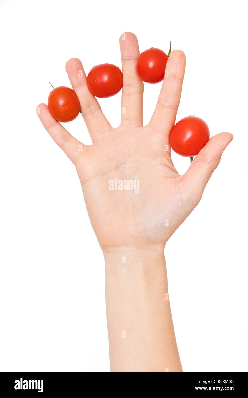 Woman hand with tomatoes between her fingers Stock Photo - Alamy