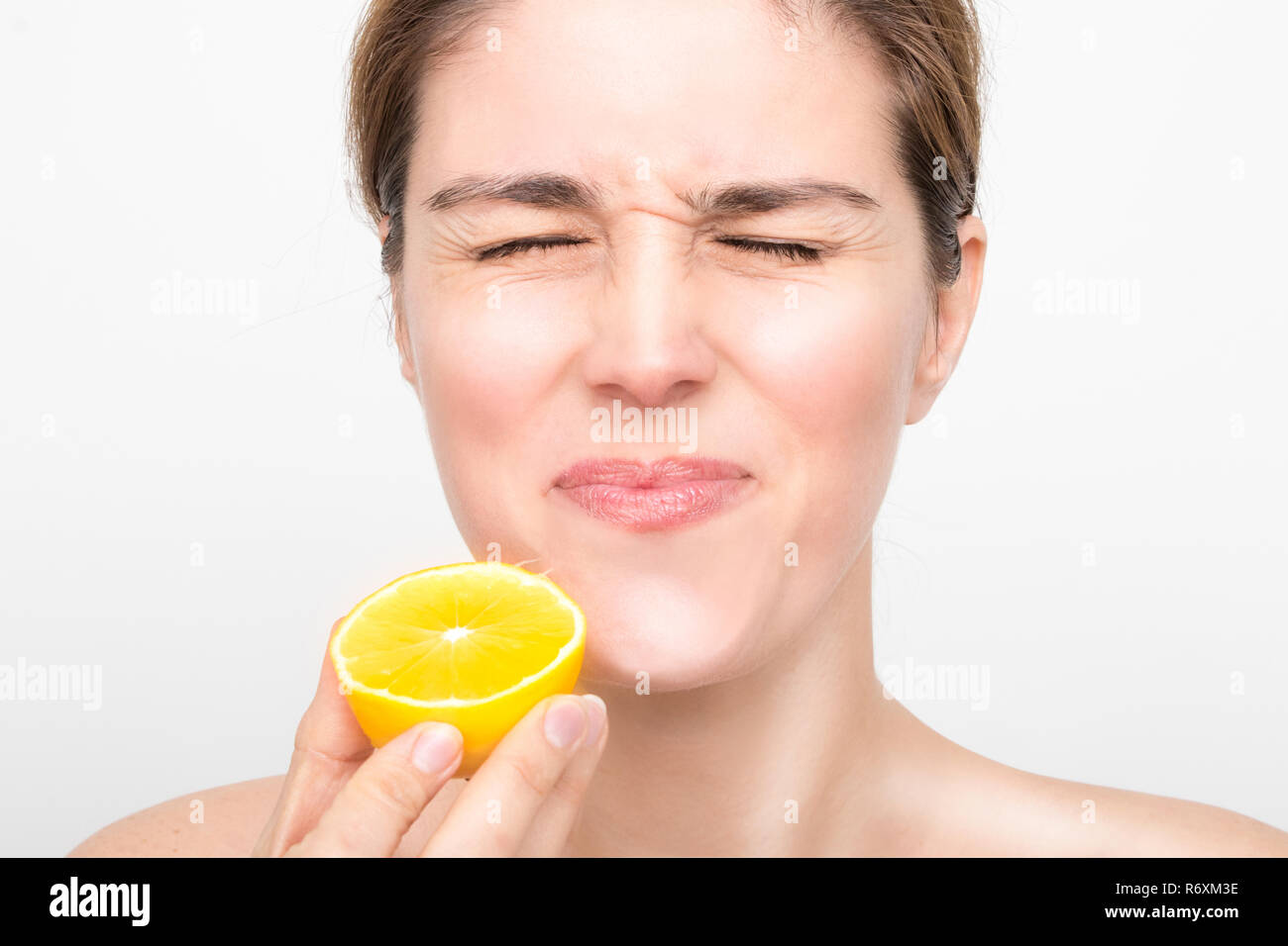Beauty Female face with fresh lemon fruits Stock Photo - Alamy