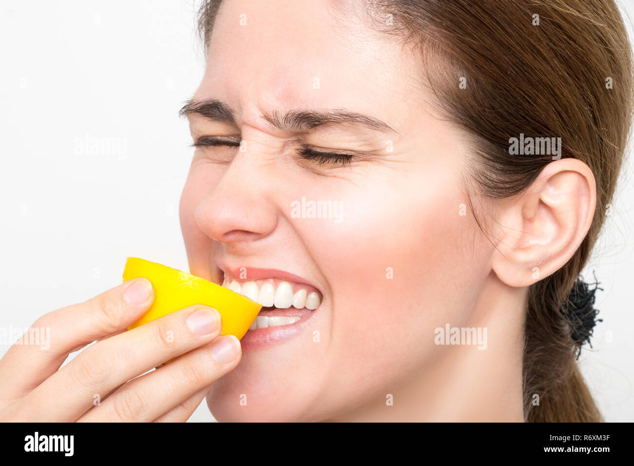 Beauty Female face with fresh lemon fruits Stock Photo - Alamy