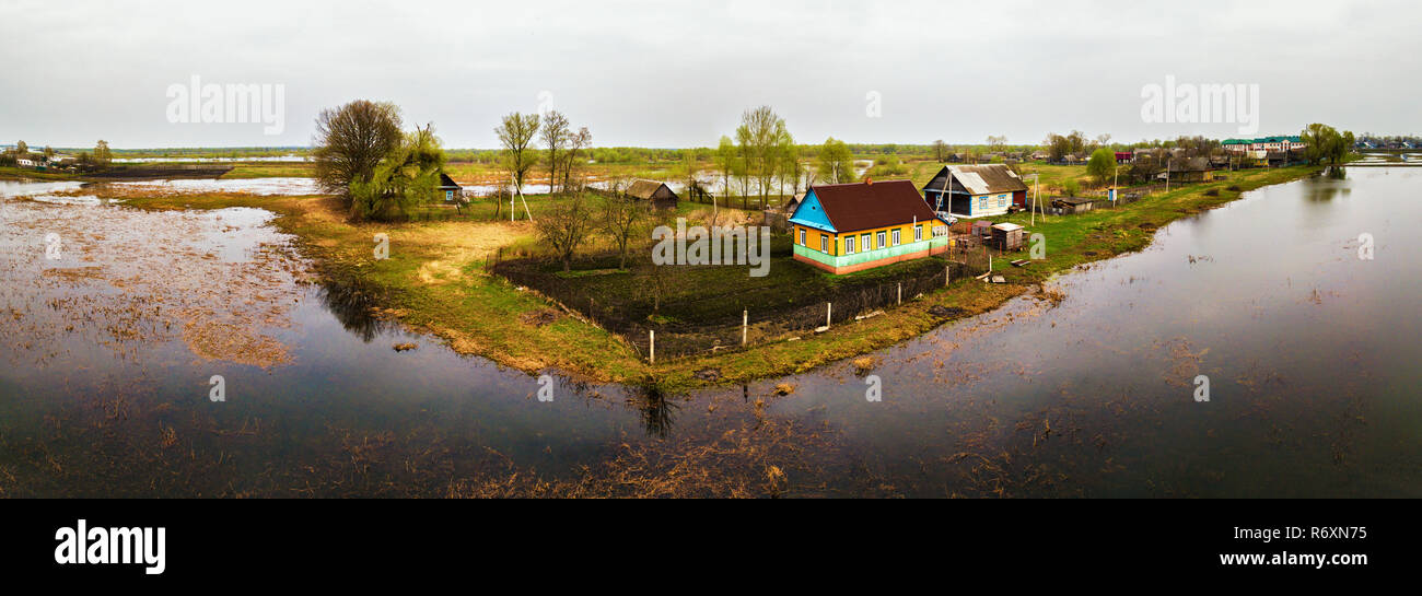 Spring melting river flood aerial panorama. Overflow water at ...