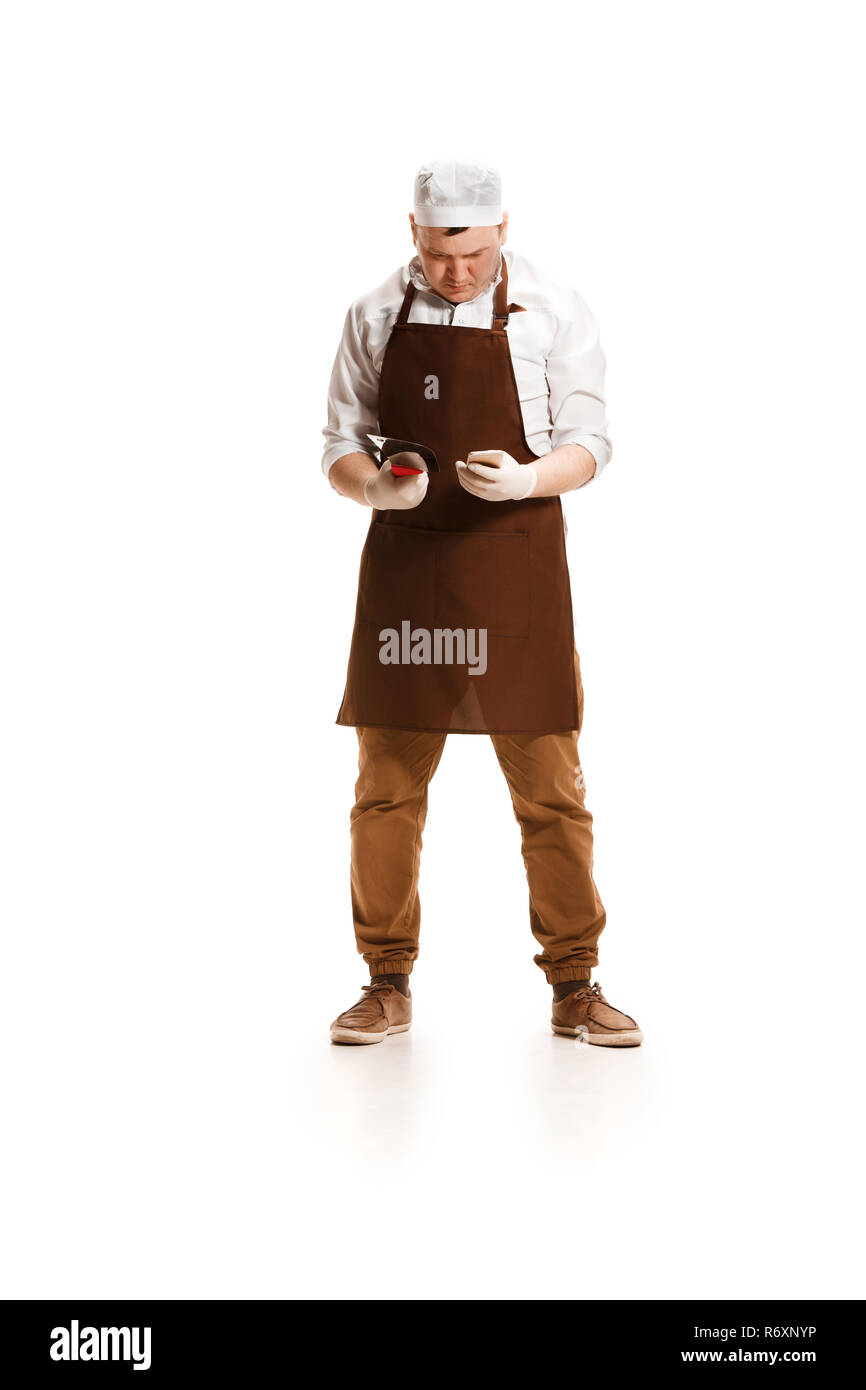 Sad butcher posing with a cleaver isolated on white background Stock ...