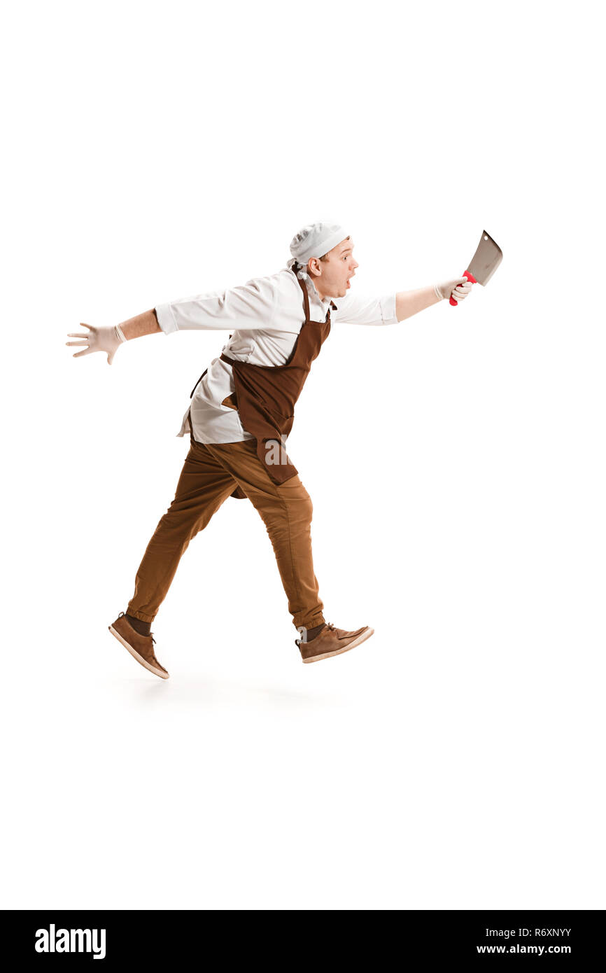 Smiling butcher posing with a cleaver isolated on white background ...