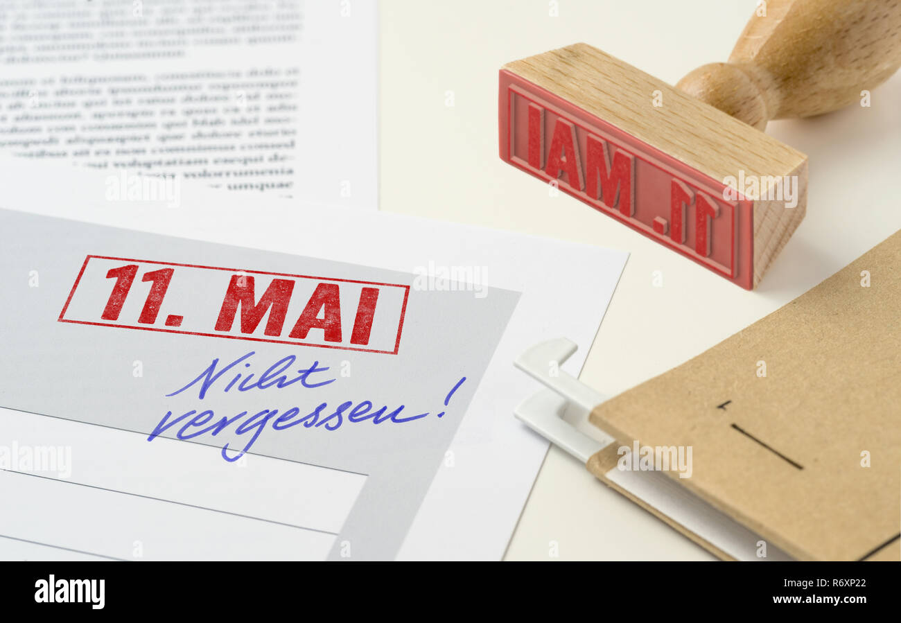 red stamp on documents - may 11th Stock Photo - Alamy
