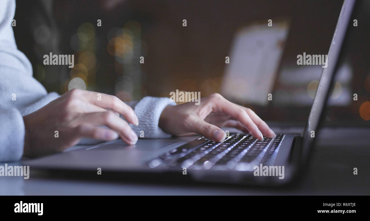 Working on laptop computer at night Stock Photo - Alamy