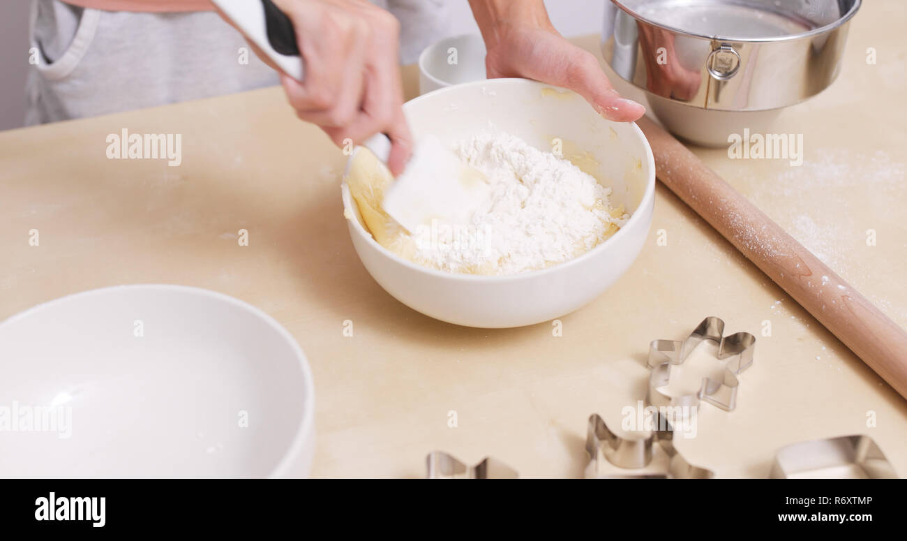 Mixing dough to make cookies Stock Photo - Alamy