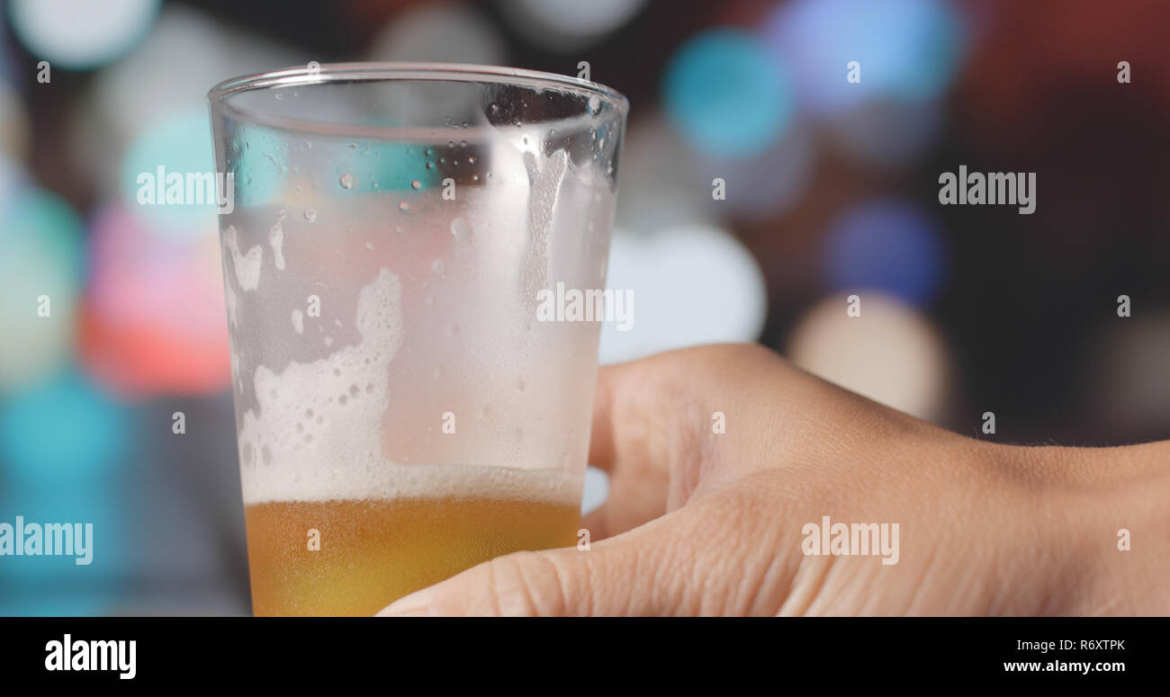 Beer with driving car at the background Stock Photo - Alamy