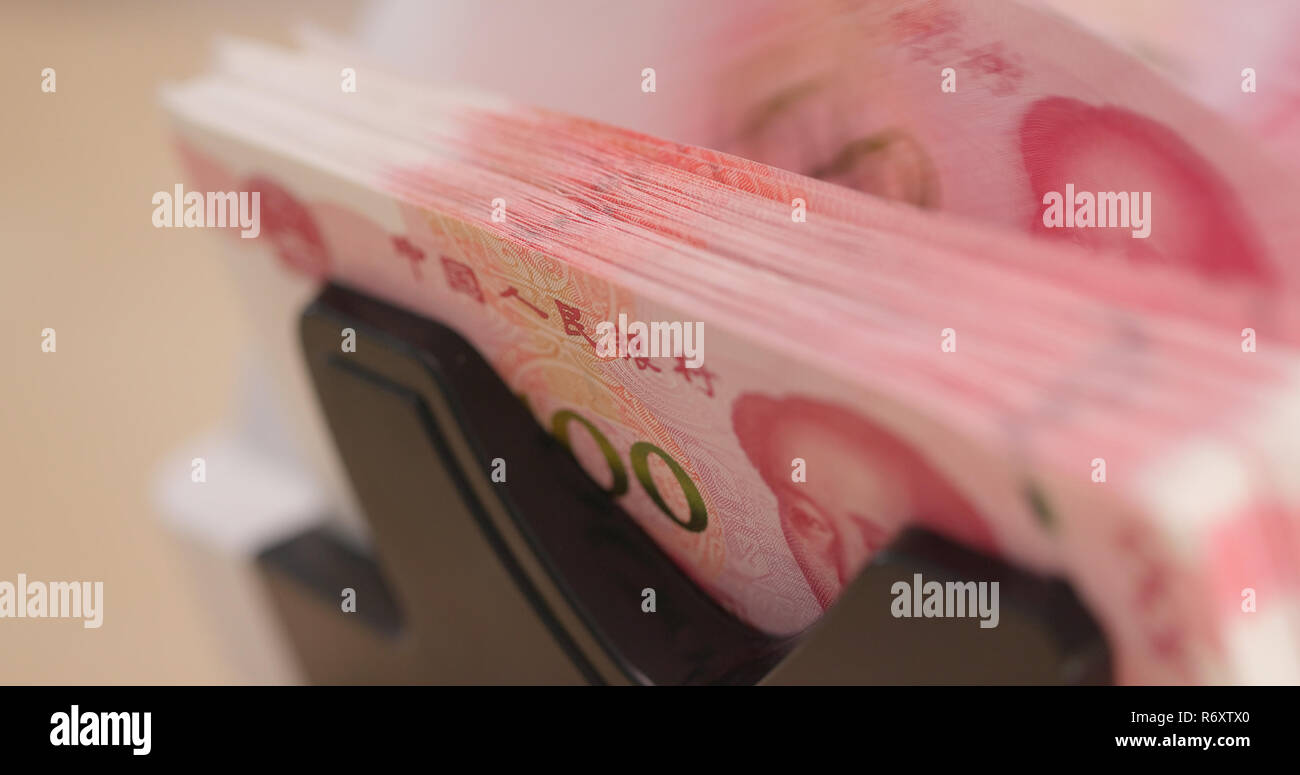 Money counting machine with RMB Stock Photo - Alamy