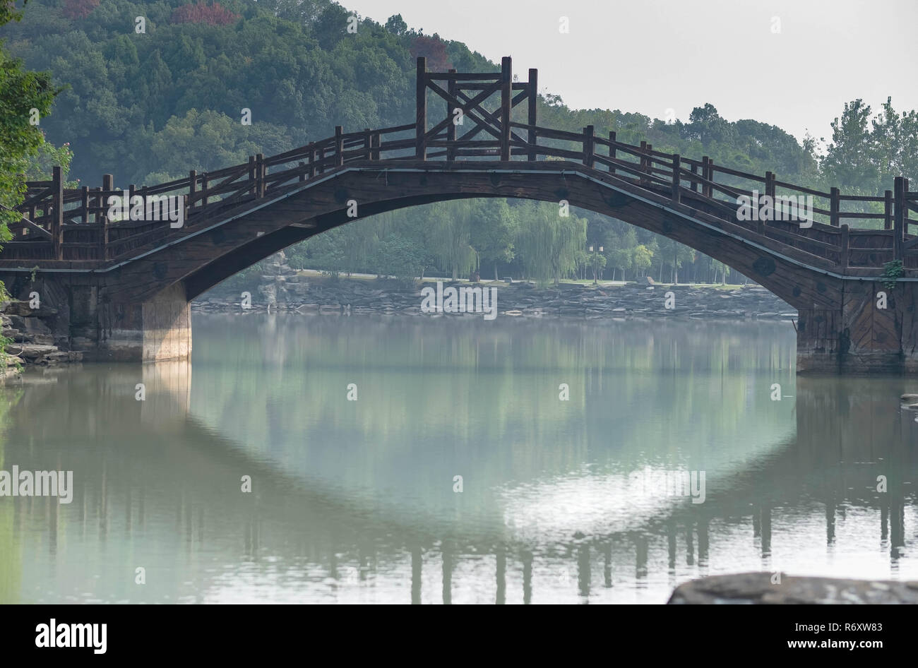 Chinese bridge on a calm canal. At Chibi city. the bridge made from the ...