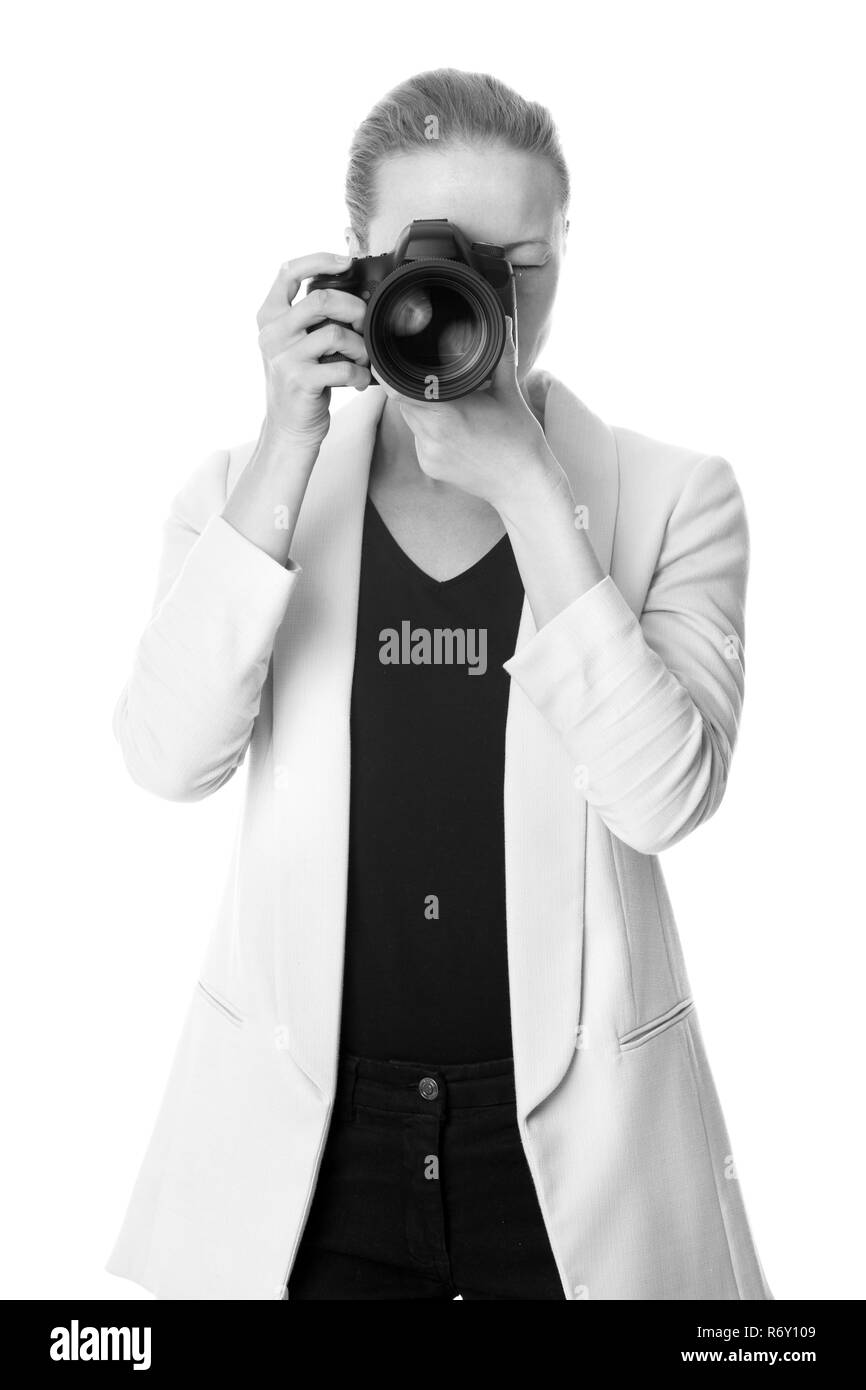 Beautiful young photographer with camera in professional studio Stock ...