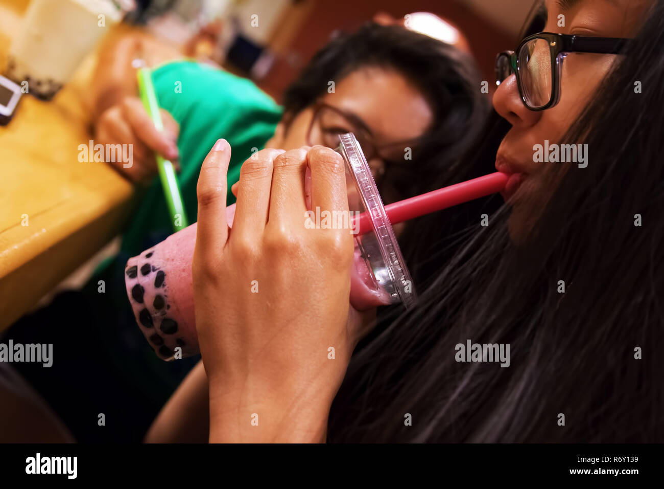 Asian American teens enjoying this Taiwan invented sweet tea based ...