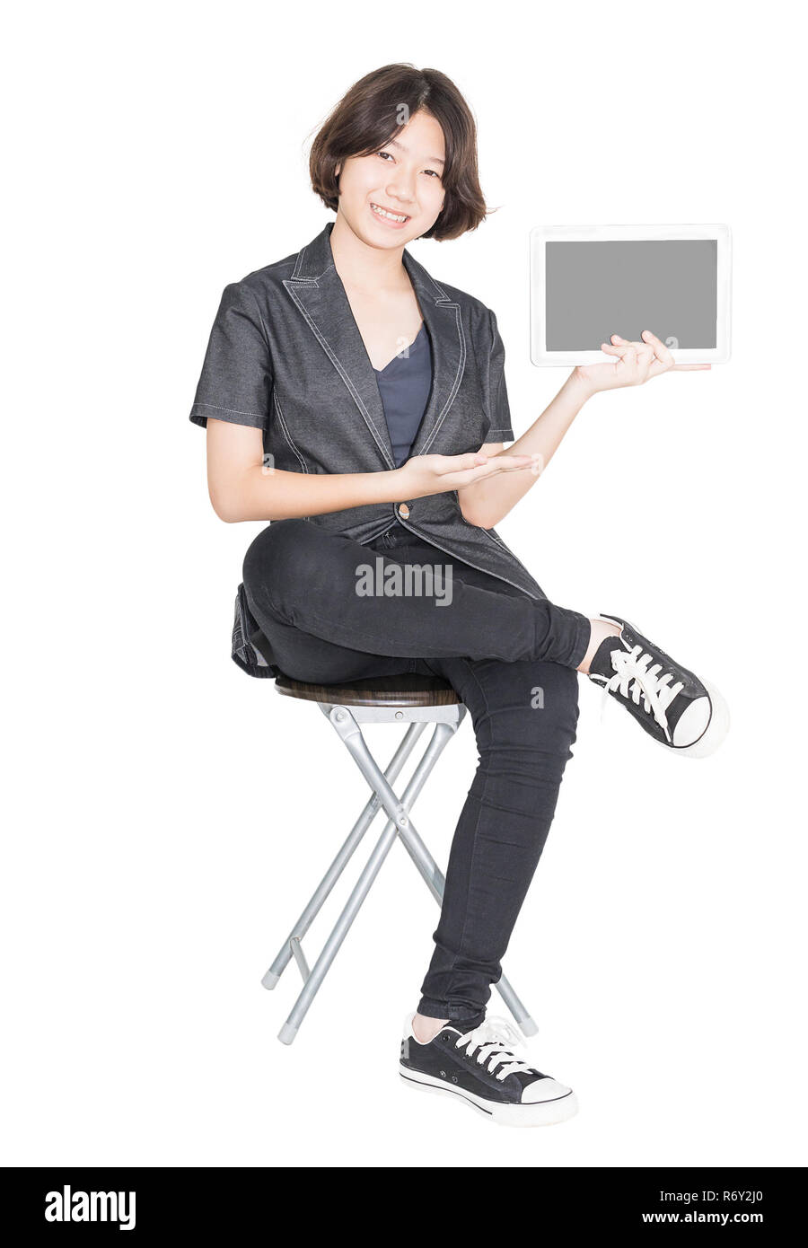 Women sit on chair with using mobile phone Stock Photo - Alamy