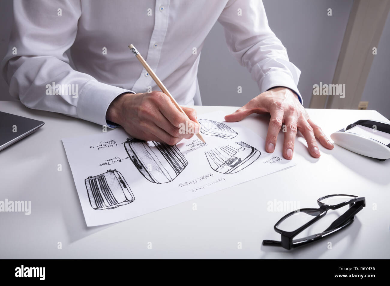 Artist Sketching On Paper With Pencil Stock Photo - Alamy