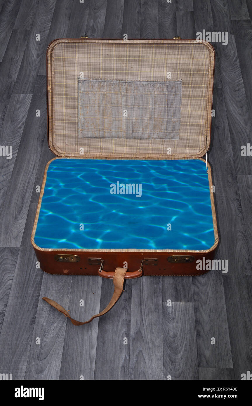 water in the suitcase Stock Photo - Alamy