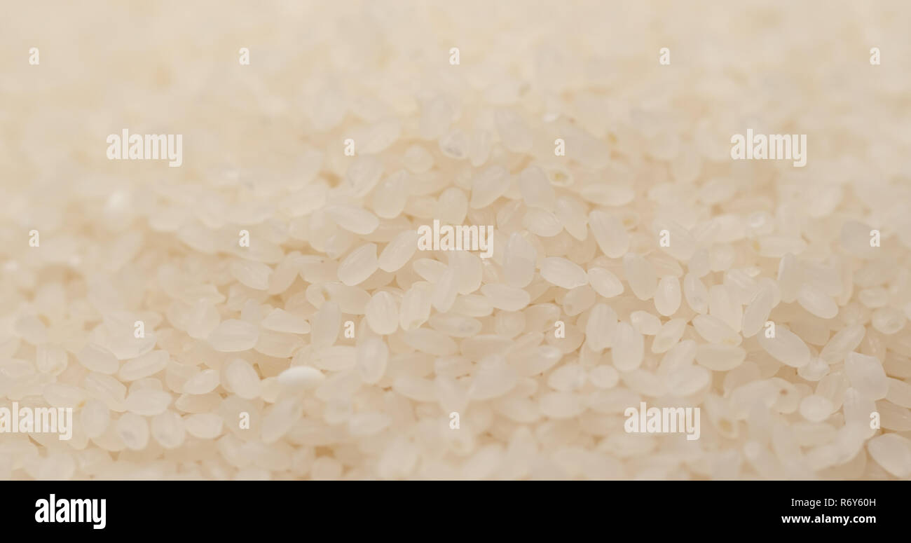 Stack of uncooked rice Stock Photo - Alamy