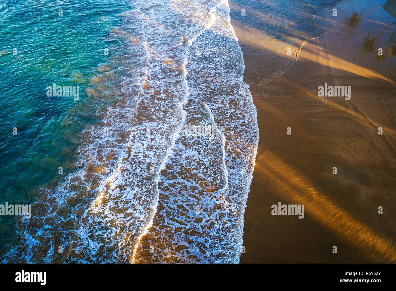 Sea sand and surf aerial photo Stock Photo - Alamy
