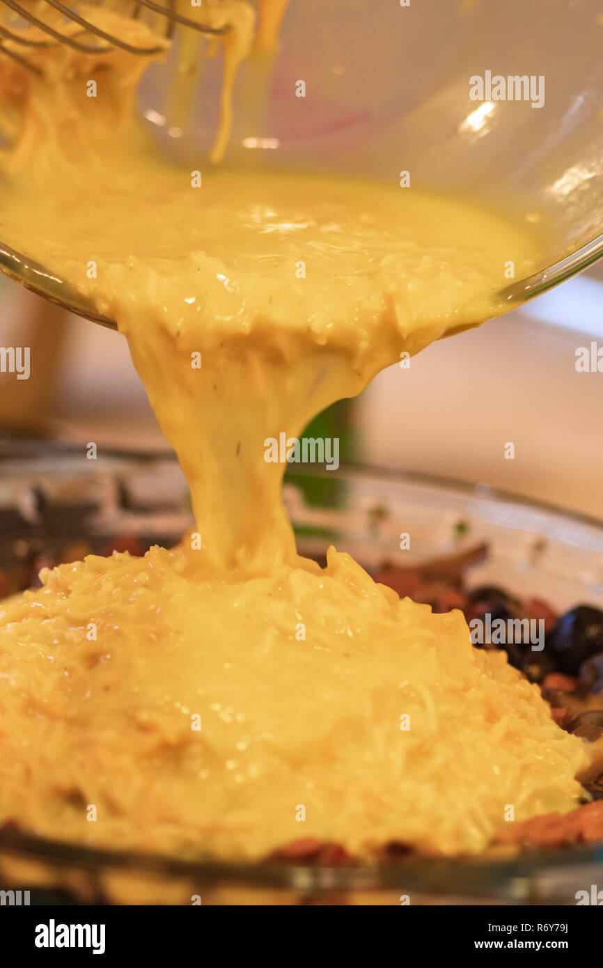 Pouring Egg And Cheese Mix Stock Photo - Alamy